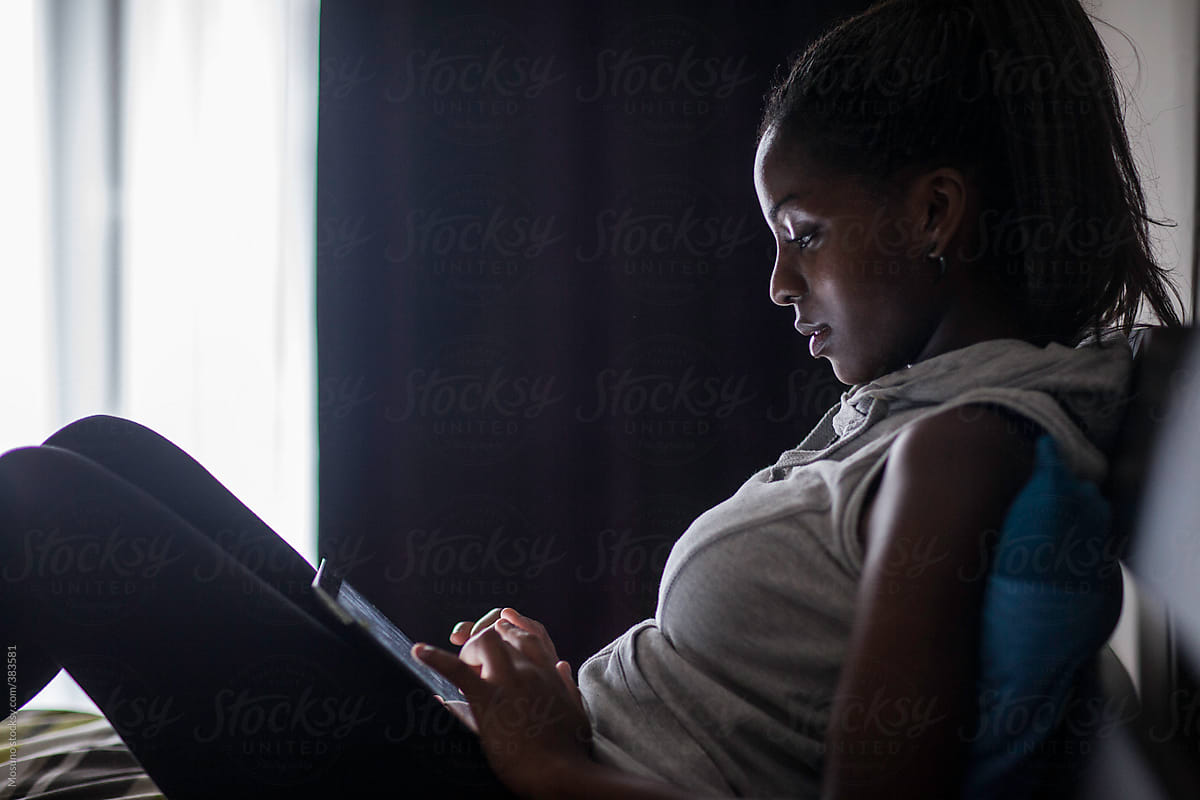 "Young Woman Looking At Tablet Computer" by Stocksy Contributor "Mosuno ...