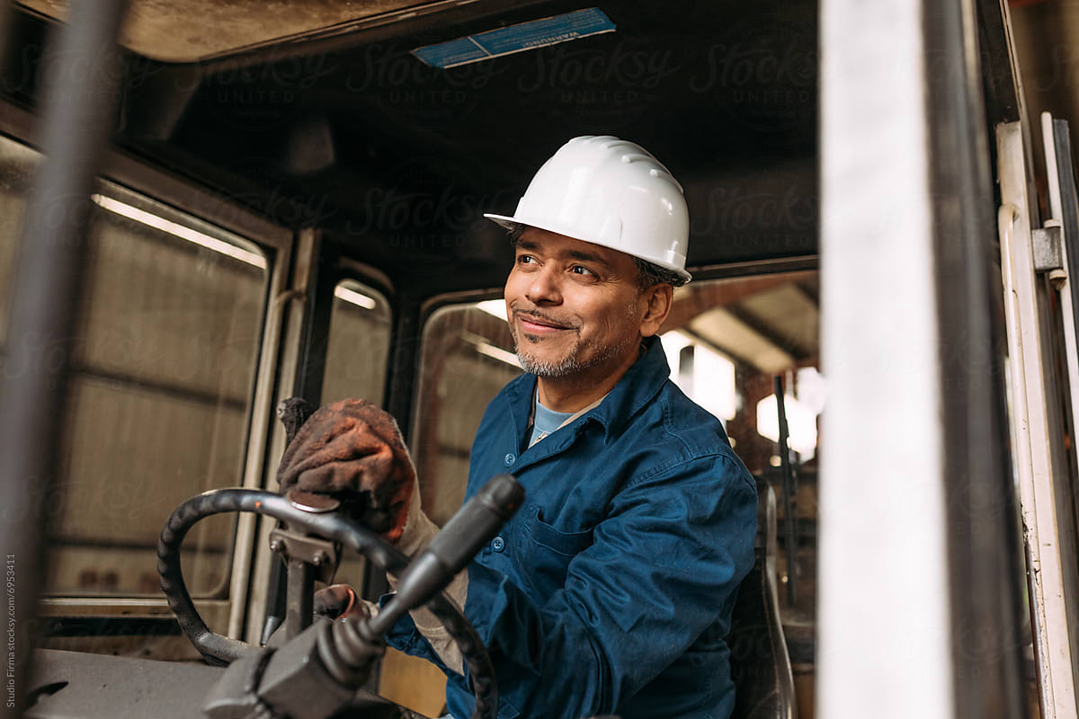 "Lift Truck Operator" by Stocksy Contributor "Studio Firma" - Stocksy