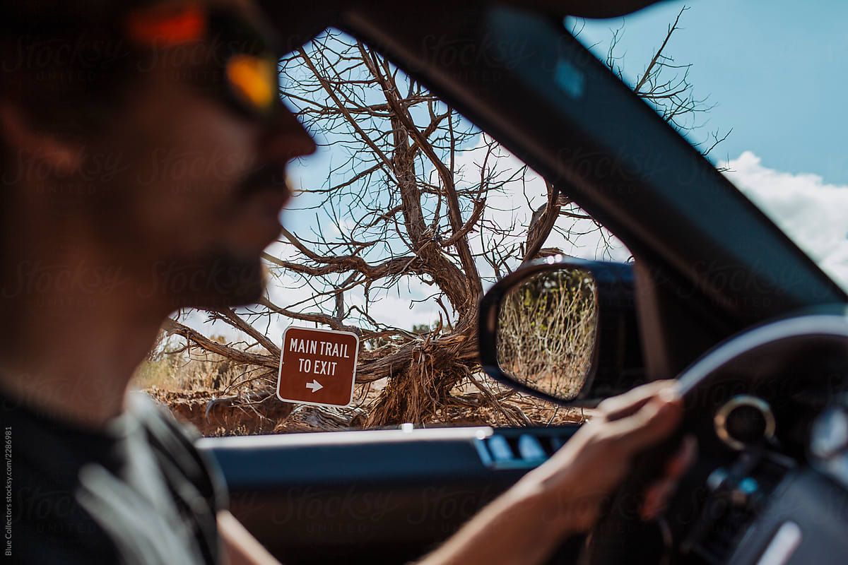 "Adventurer Man Driving" by Stocksy Contributor "Jordi Rulló" - Stocksy