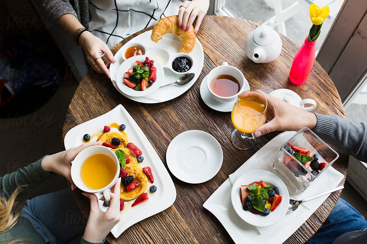 "Group Of Friends Having Breakfast Indoors" by Stocksy Contributor ...