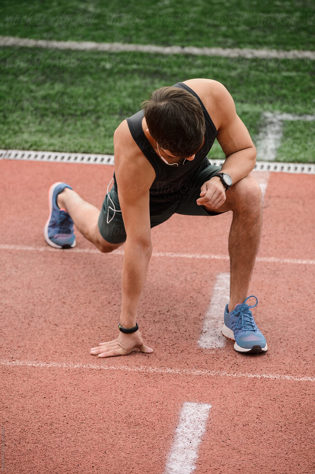 "Man Warming Up" by Stocksy Contributor "Milles Team" - Stocksy