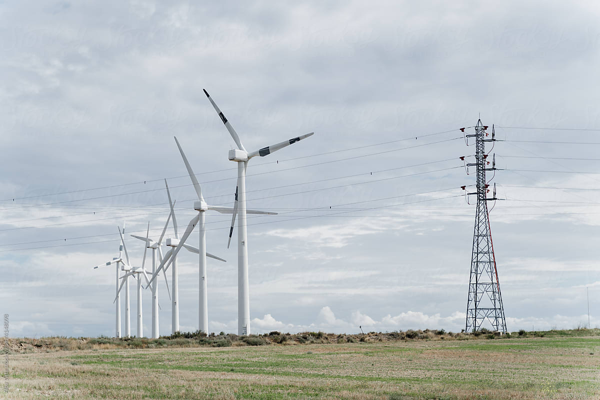 "Eolic Windmills On Field And Electricity Tower" by Stocksy Contributor ...