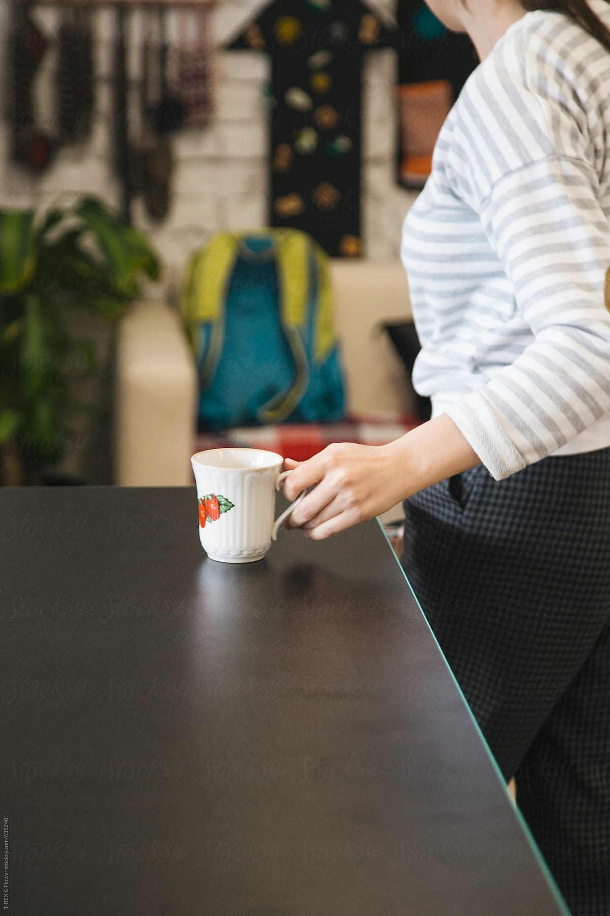 "She Puts The Cup On The Table" by Stocksy Contributor "Danil Nevsky ...