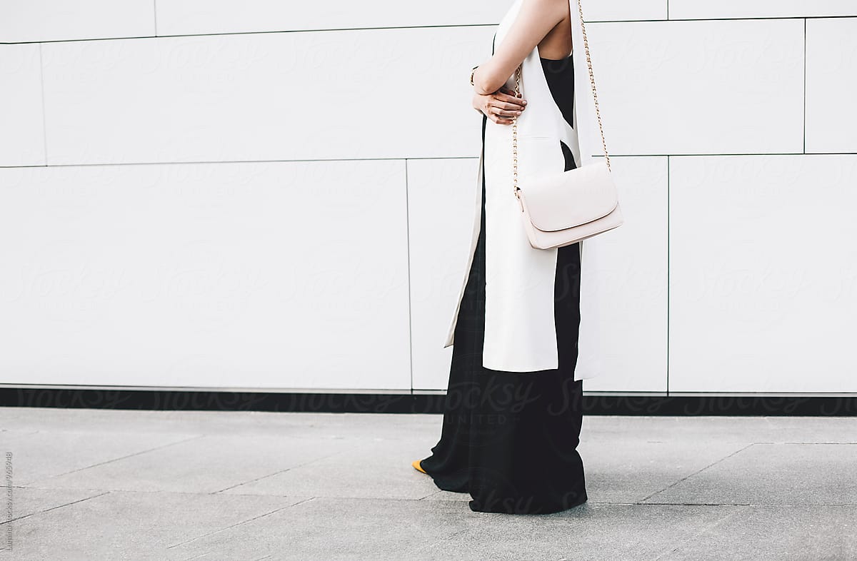 "Woman Carrying Her Handbag" by Stocksy Contributor "Lumina" - Stocksy