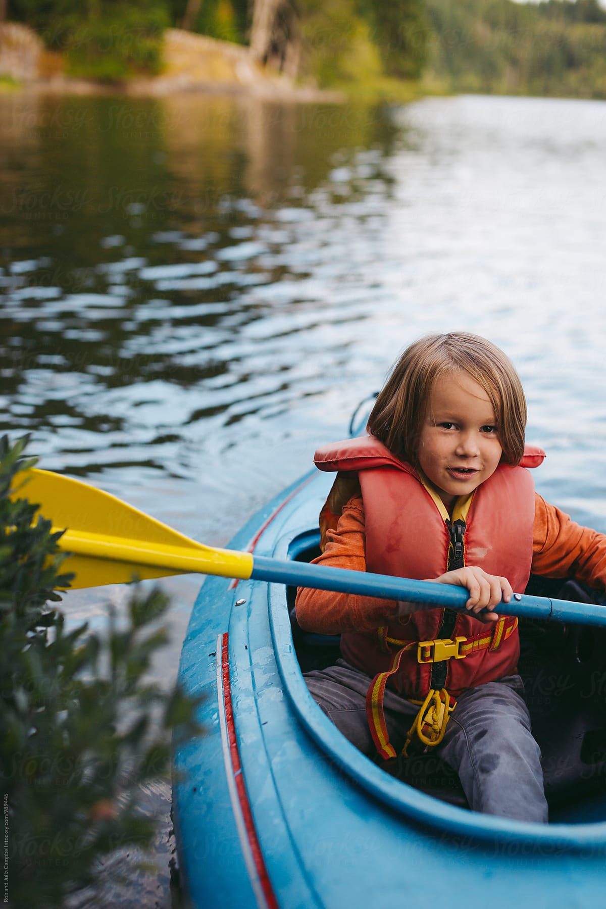 "Young Caucasian Boy Enjoying Kayak On Lake In Summer" by Stocksy ...