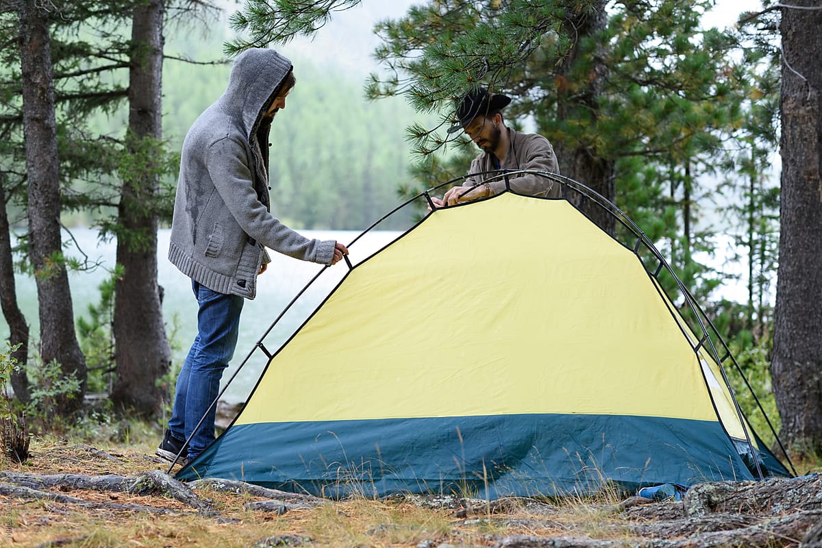 "Men Pitching The Tent" by Stocksy Contributor "Milles Team" - Stocksy