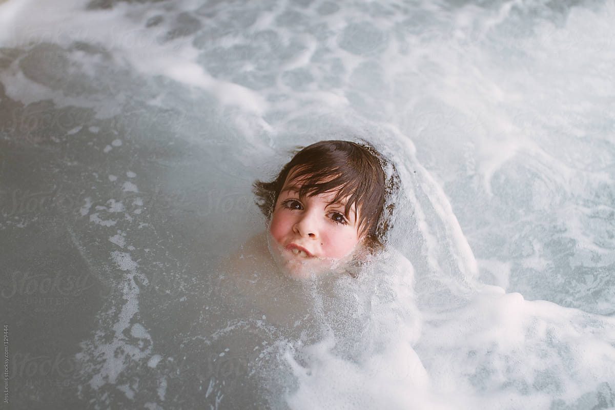 "Boy Submerged In Water" by Stocksy Contributor "Jess Lewis" - Stocksy