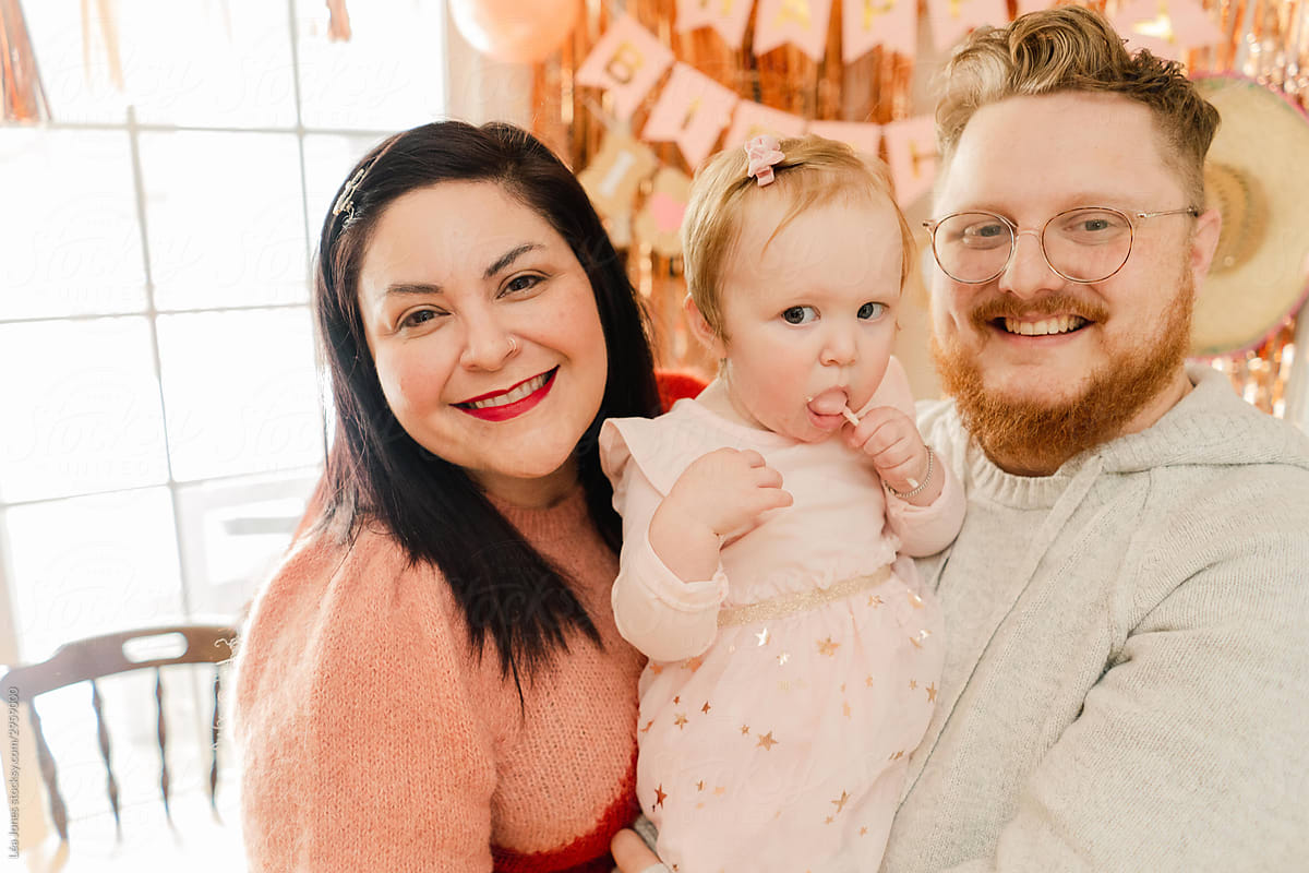 "Stock Photo Of Caring Parents Holding Their Beautiful Baby Girl" by ...
