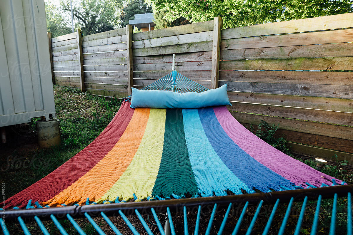 "Rainbow Hammock In Backyard" by Stocksy Contributor "Leah Flores ...