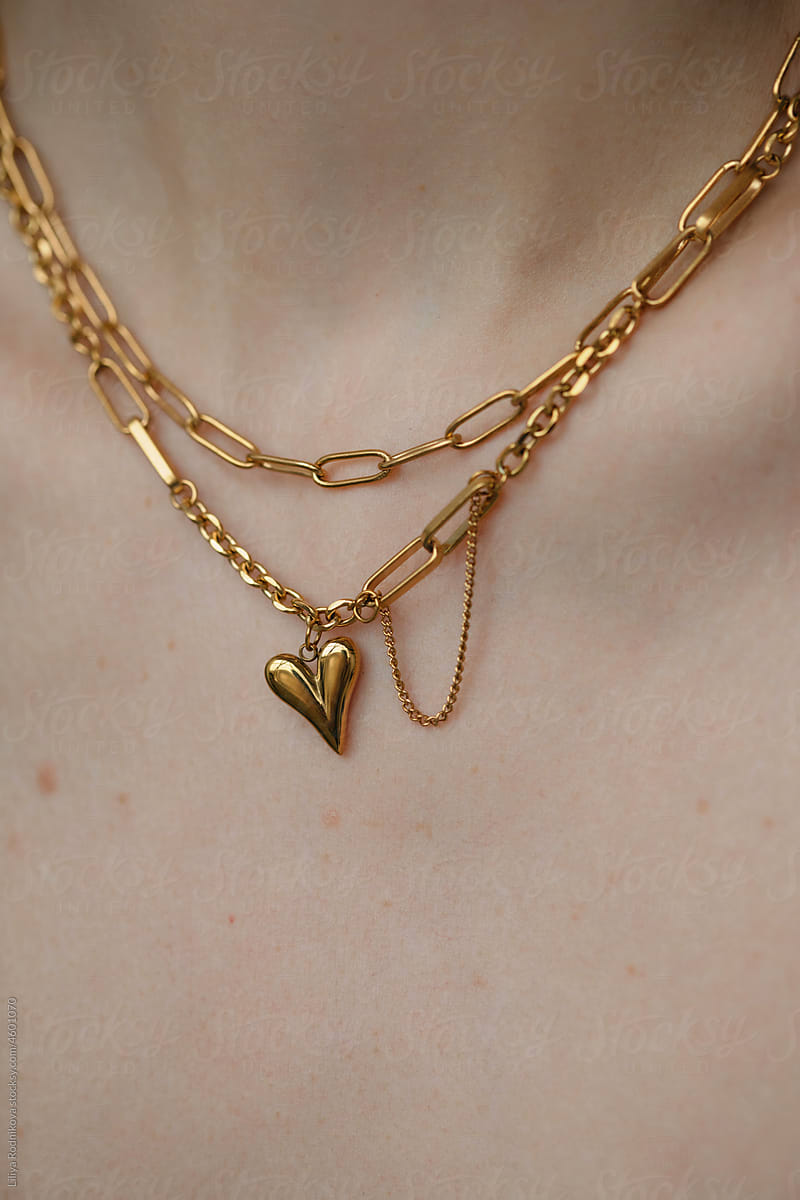 "Necklace With Golden Chain And Heart Pendant" by Stocksy Contributor ...