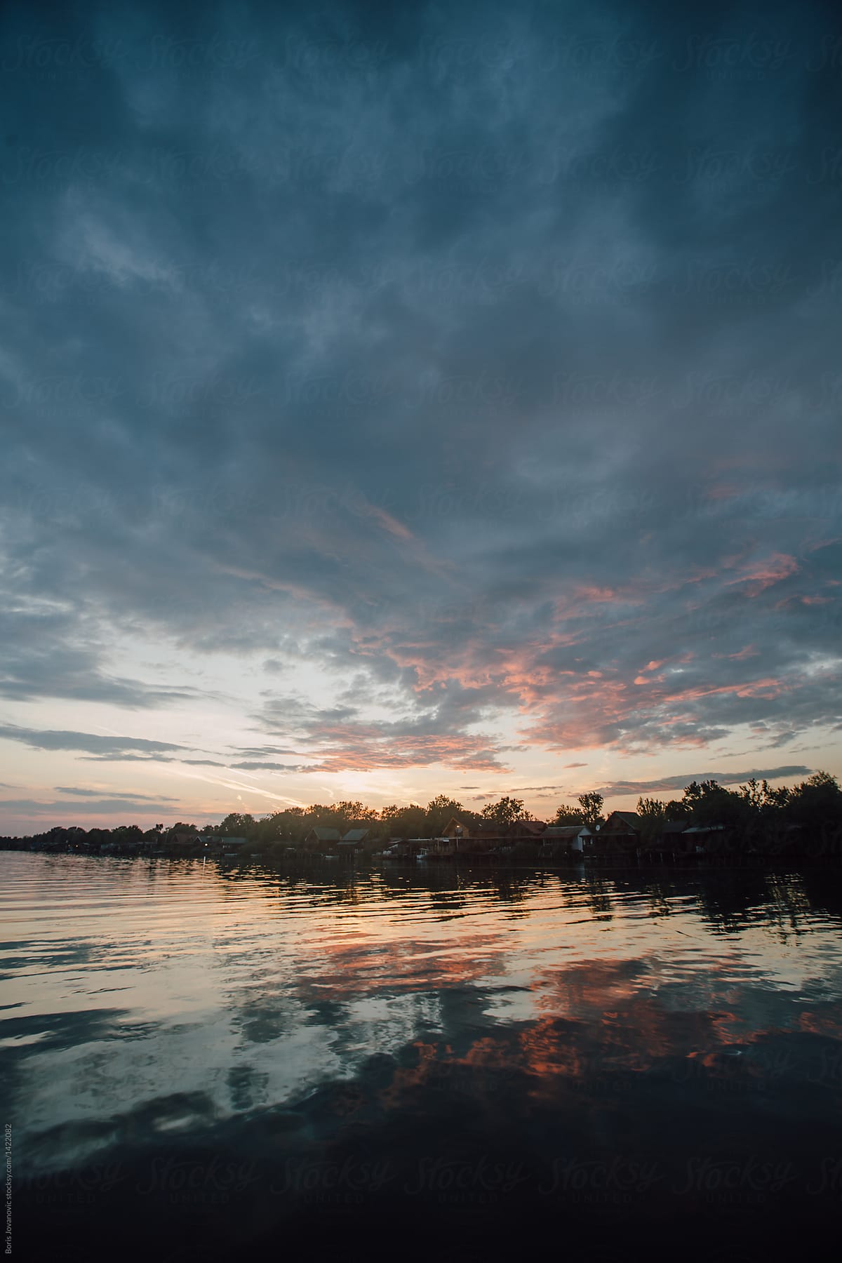 "A Sunset On The Bay" by Stocksy Contributor "Boris Jovanovic" - Stocksy