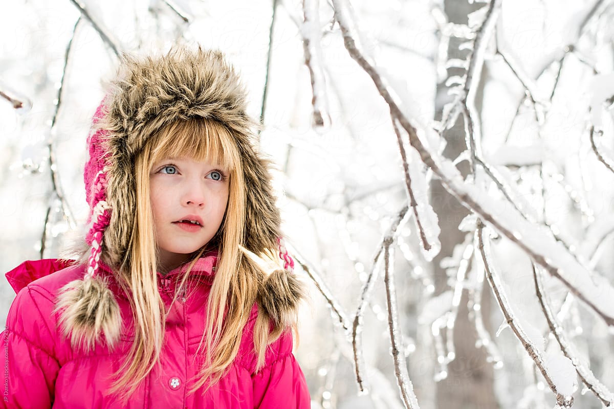 "Little Girl Exploring Cold Winter Woods With Frozen Ice And Snow" by ...