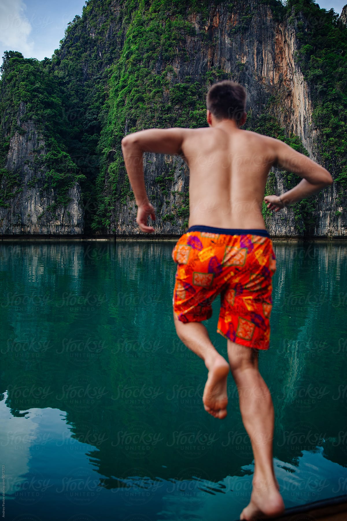 "Back View Of Man Jumping From Boat" by Stocksy Contributor "Andrey ...