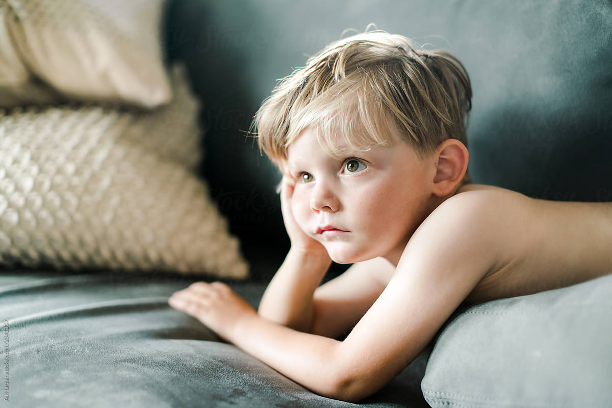 "Little Boy Watching Tv" by Stocksy Contributor "Ali Harper" - Stocksy