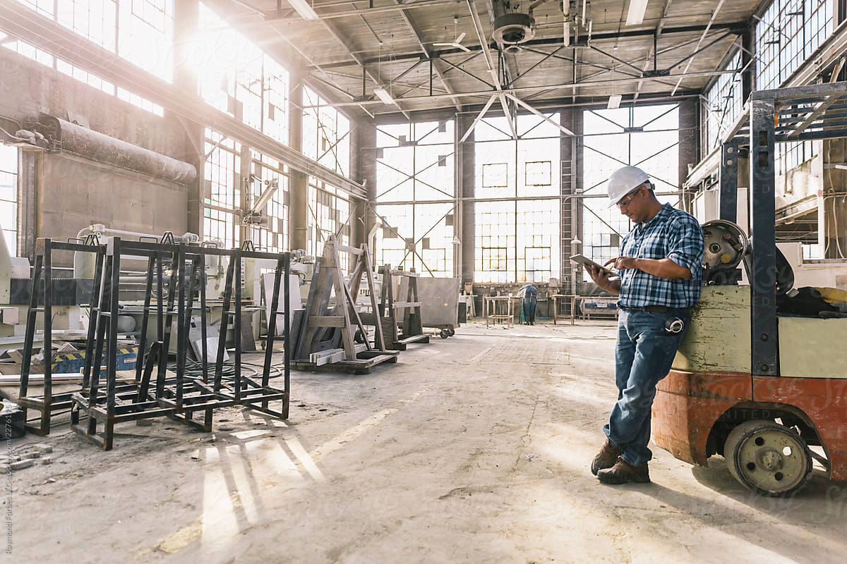 "Hispanic Man Using Computer At Work" by Stocksy Contributor "Raymond ...