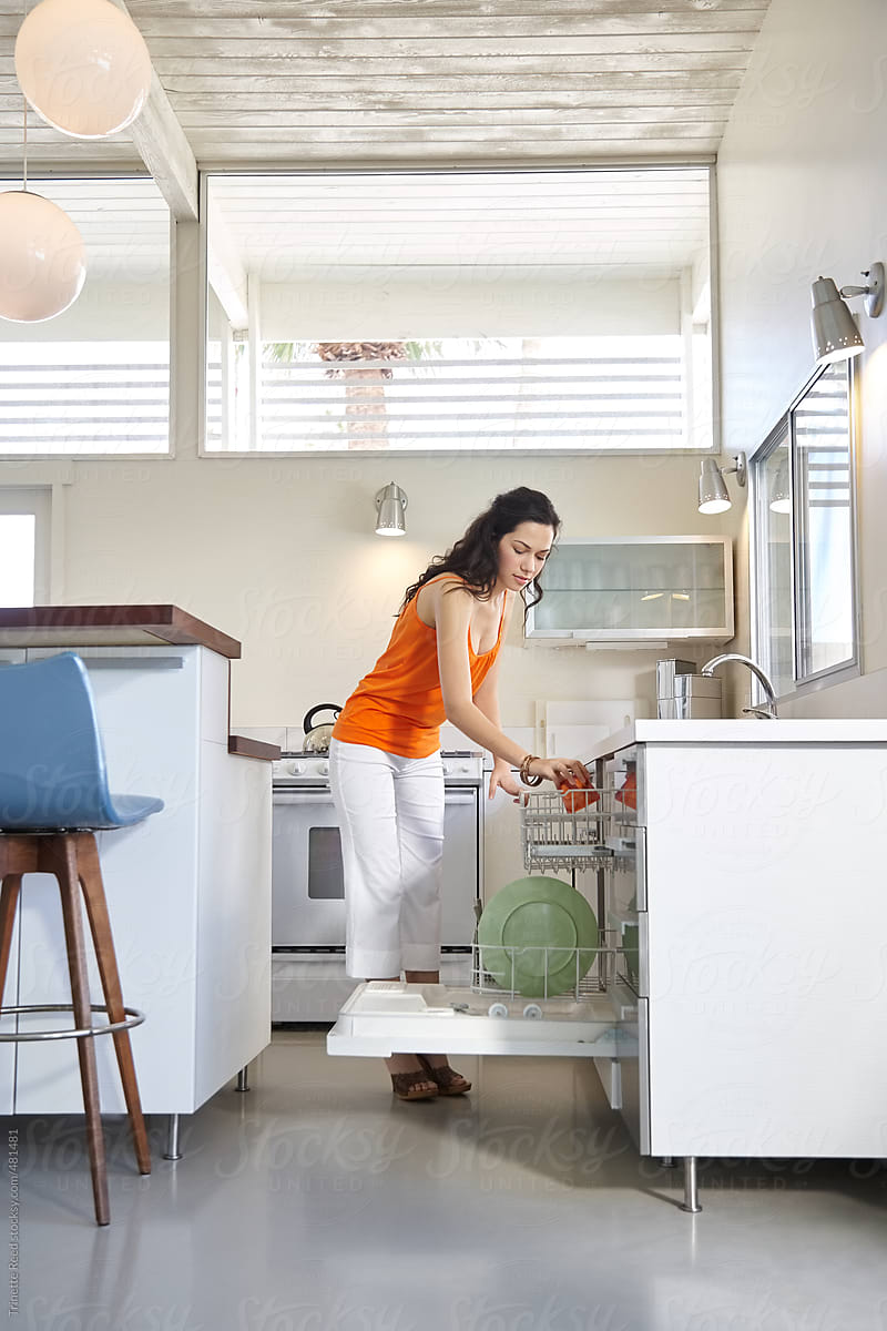 "Hispanic Woman Loading The Dishwasher" by Stocksy Contributor ...