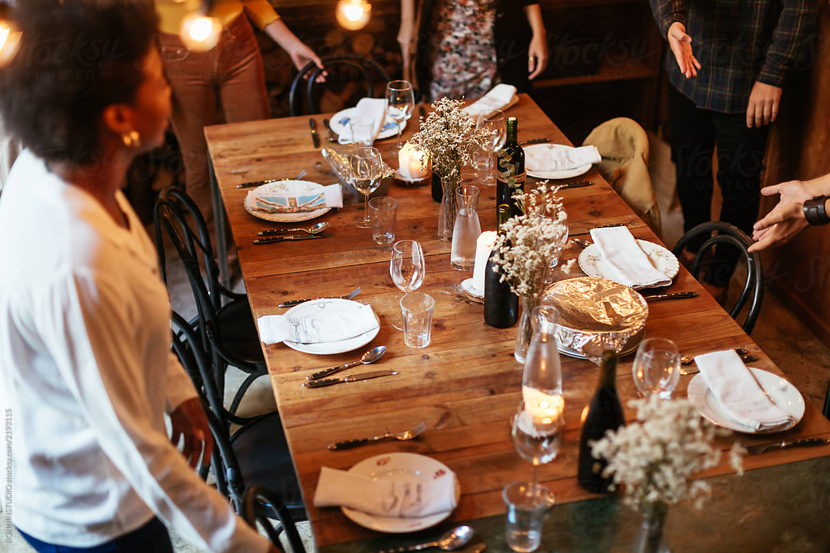 "Indoor Dinner Party." by Stocksy Contributor "BONNINSTUDIO " - Stocksy