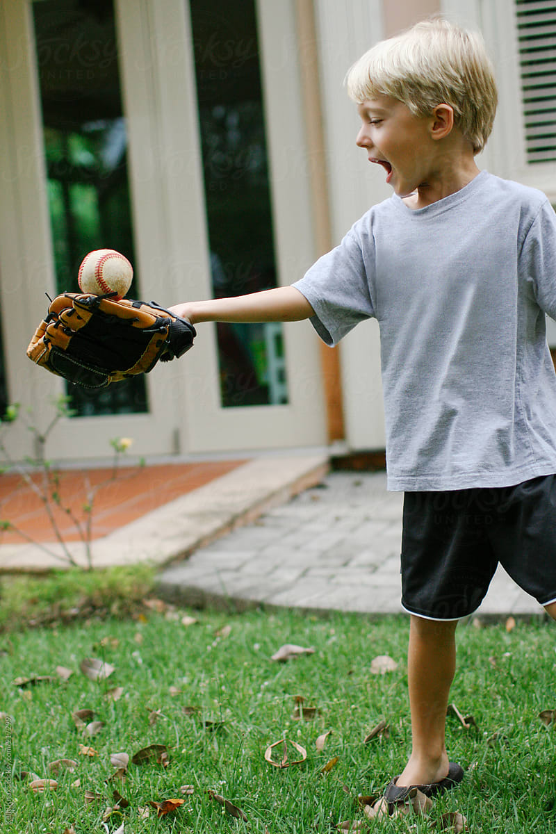 "Young Boy Playing Catch In The Backyard" by Stocksy Contributor "Kelly ...