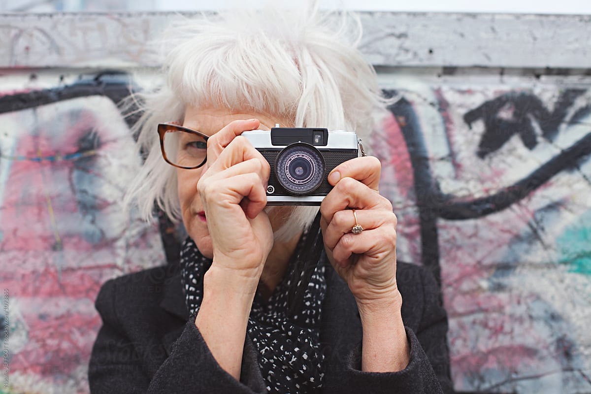 "Older Mature Female / Woman Using A Camera Outdoors In Front Of ...
