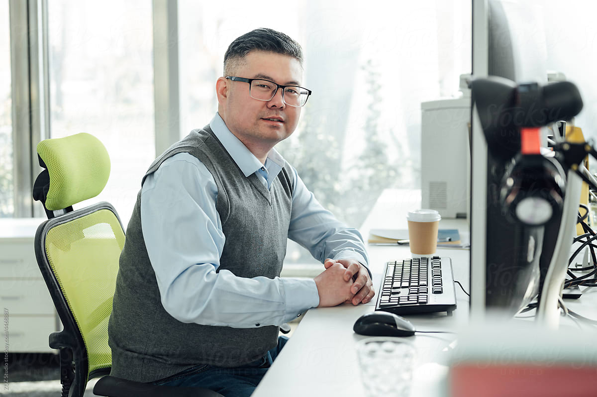 "Portrait Of Chinese Male Engineer With Computer In Office" by Stocksy ...