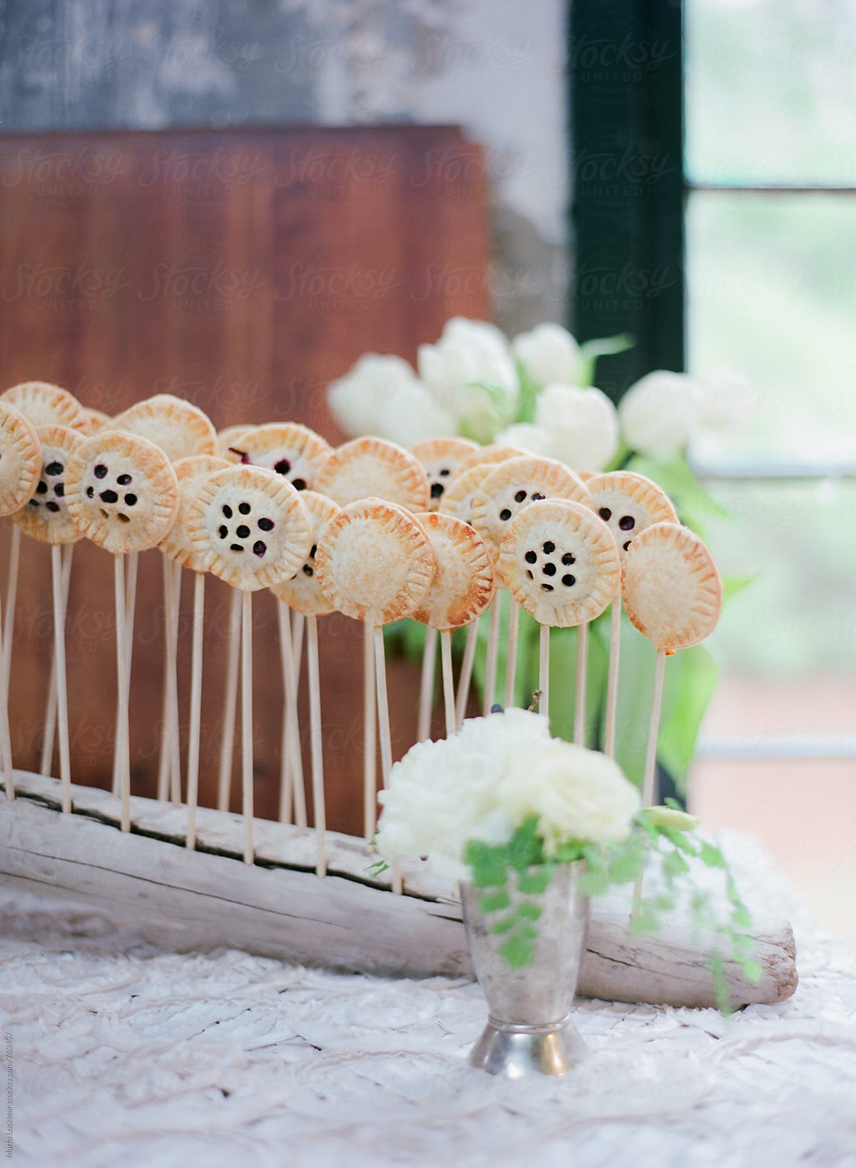 Mini Pie Pops Displayed In Driftwood Stand By Stocksy Contributor Marta Locklear Stocksy