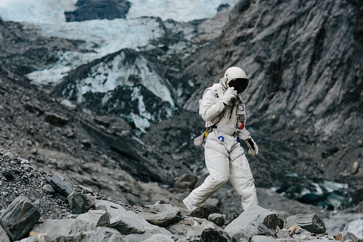 "Astronaut Travels Across Rigid Landscape" by Stocksy Contributor "HOWL ...