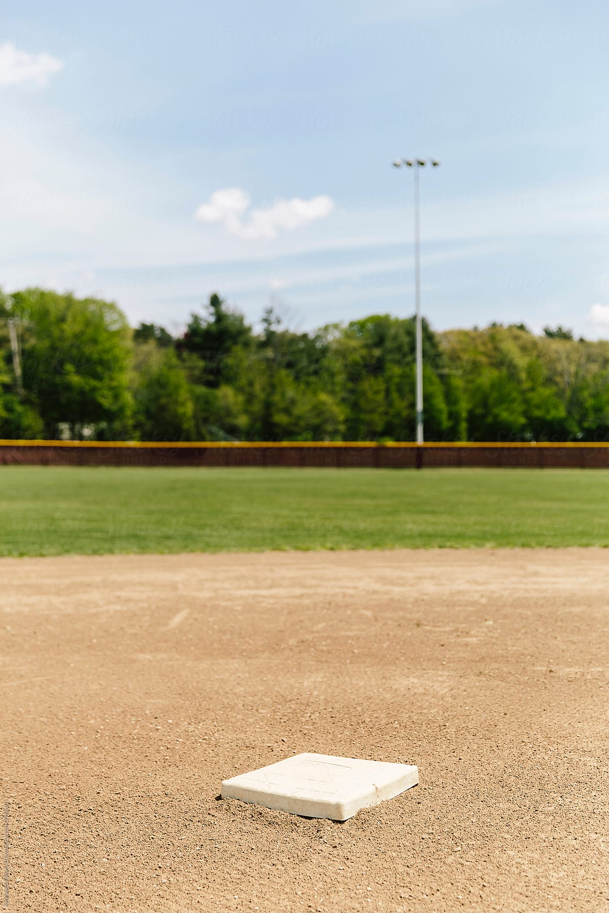 "Second Base On Baseball Field" by Stocksy Contributor "Raymond Forbes ...