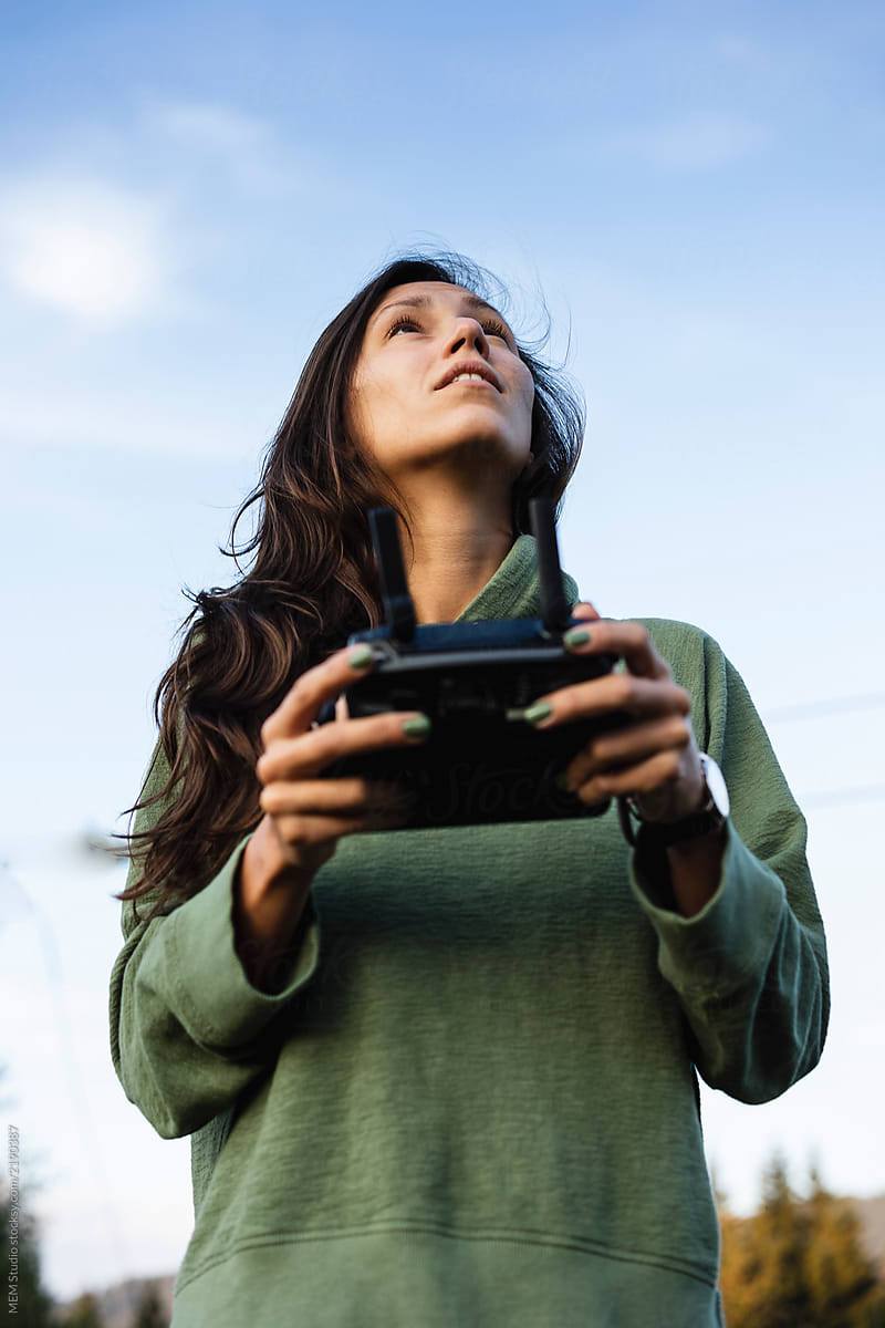 "Young, Beautiful Woman Piloting A Drone" by Stocksy Contributor "MEM ...