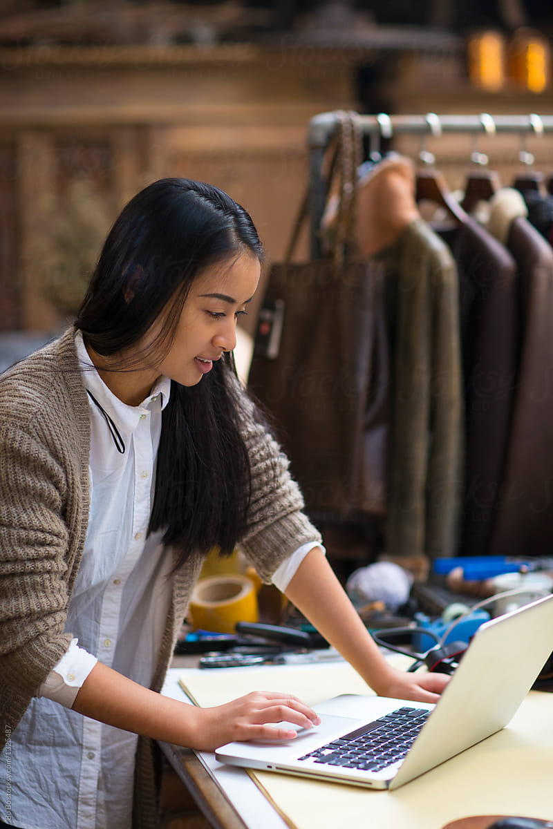 "One Young Female Chinese Fashion Designer Indoor" by Stocksy ...