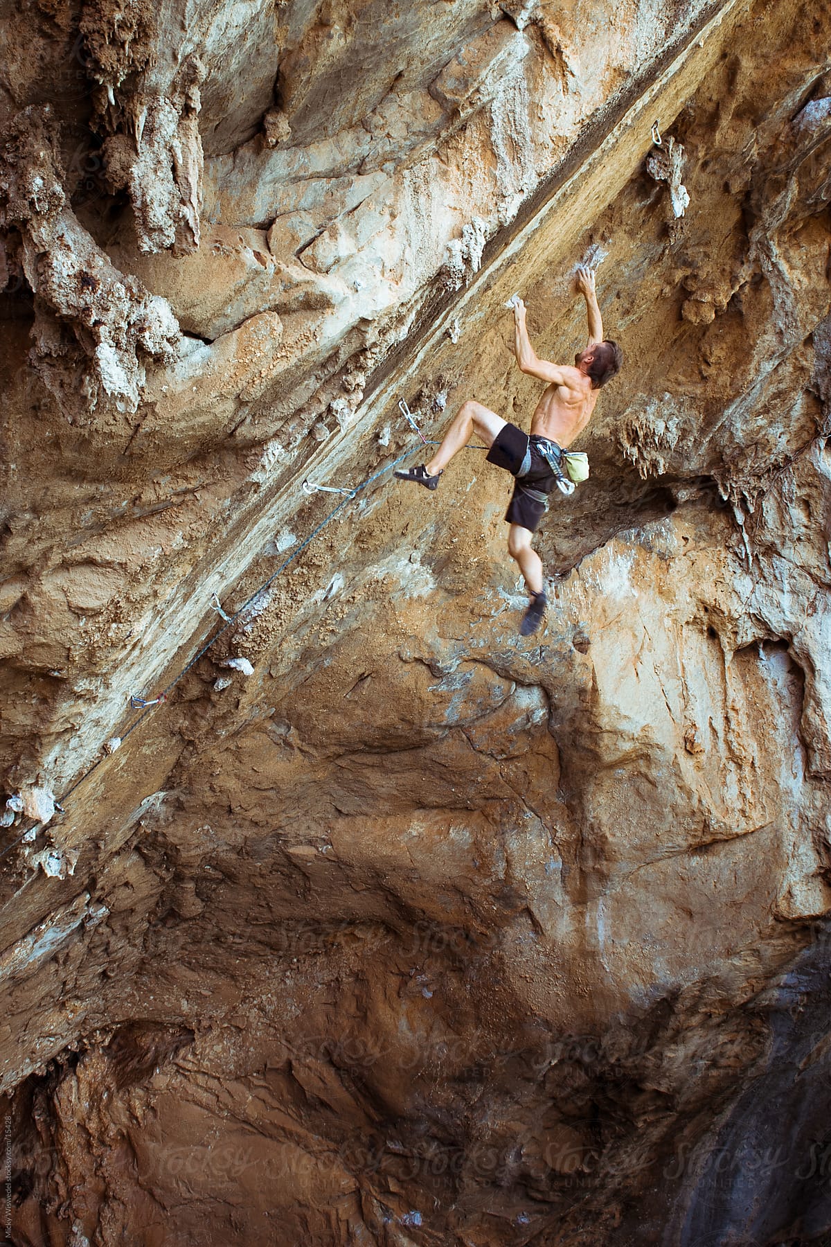 "Rock Climber Climbing" by Stocksy Contributor "Juno" - Stocksy