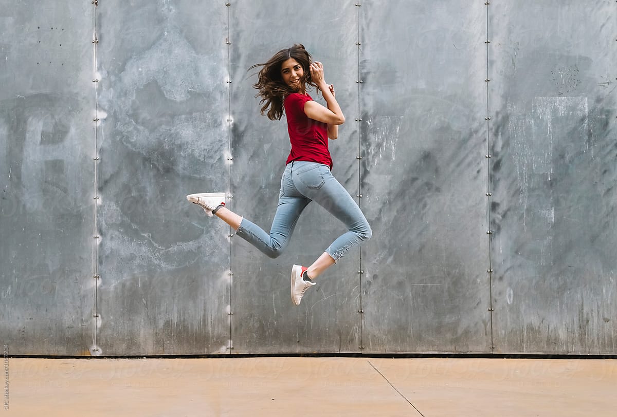 "Woman Jumping Against A Wall" by Stocksy Contributor "koganami studio ...