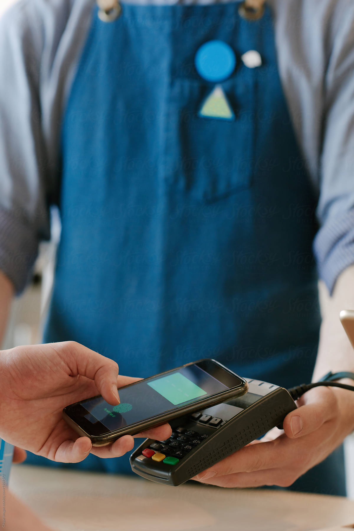 "Customer Paying With Smartphone" by Stocksy Contributor "Clique Images ...