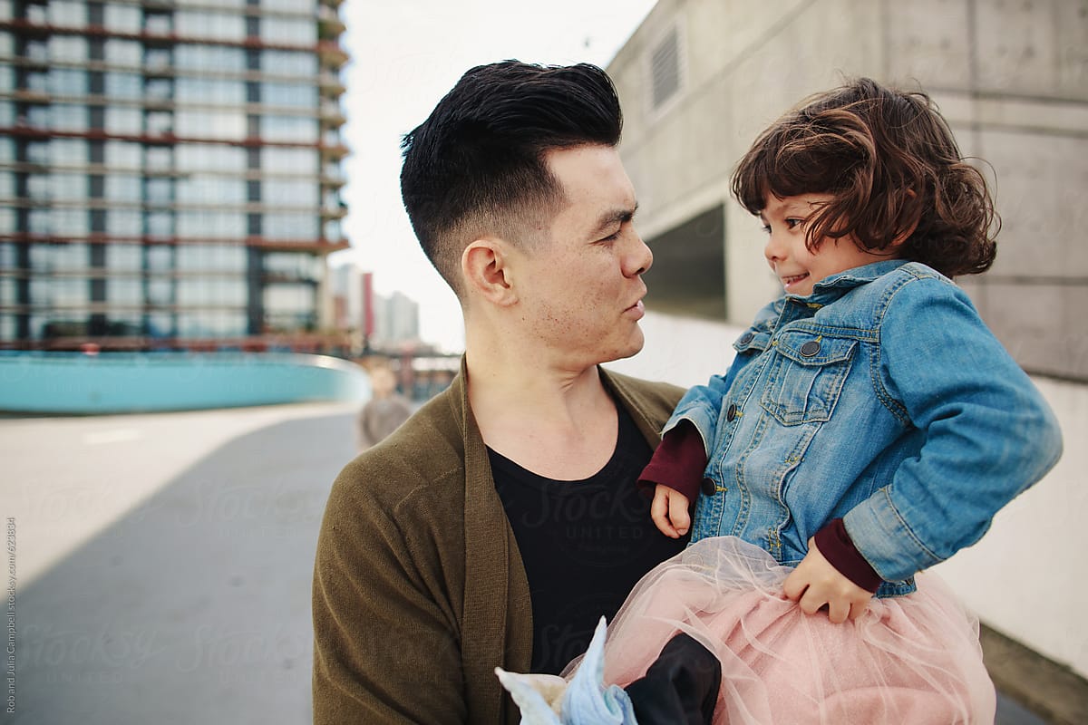 "Young Dad Having Fun Cuddling With Little Girl Outside" by Stocksy ...