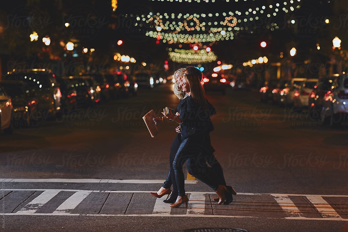 "Cute Women Crossing The Street At Night" by Stocksy Contributor ...
