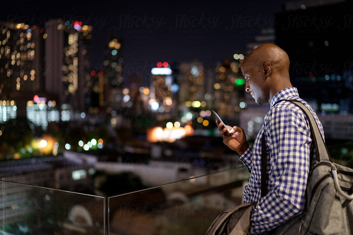 "Man Using His Phone At Night" by Stocksy Contributor "Jovo Jovanovic ...