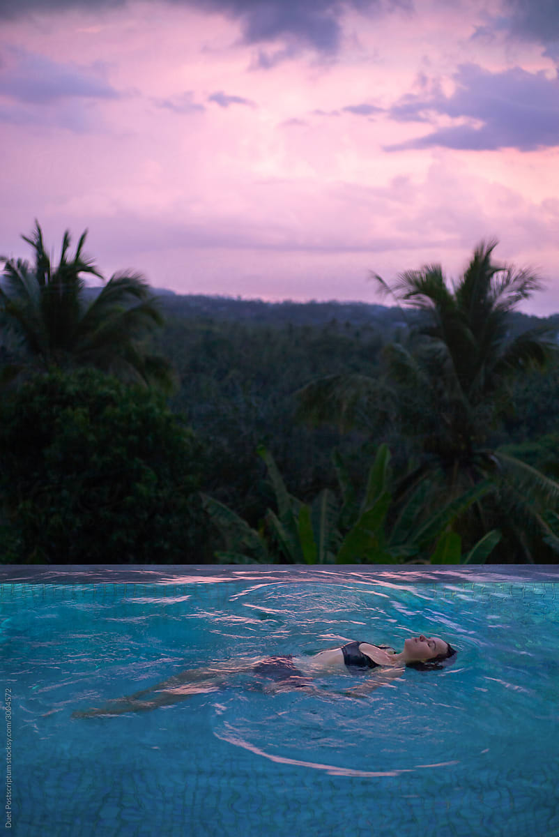 "Girl Swims At Sunset In Swimming Pool." by Stocksy Contributor "Duet ...