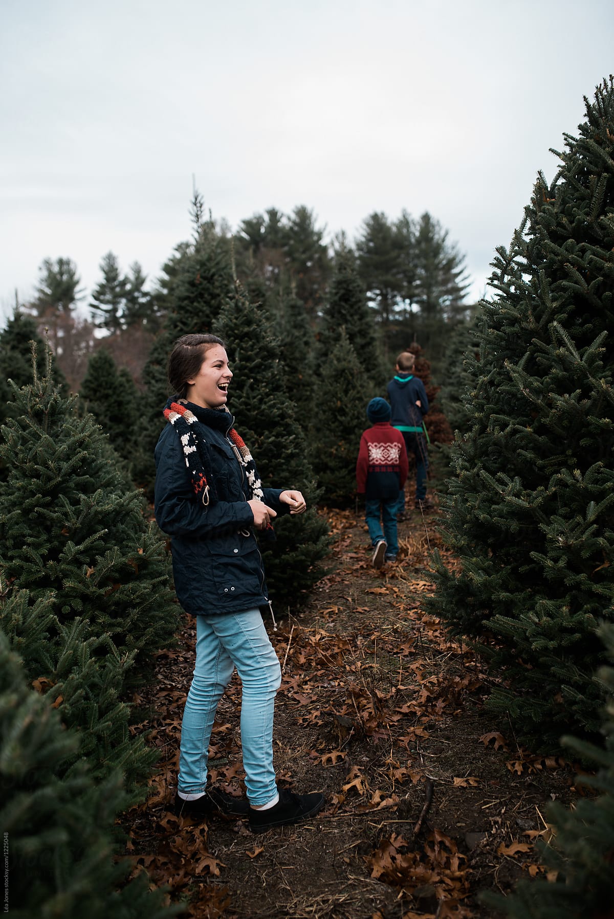 "Excited Teen Looking At Christmas Tree" by Stocksy Contributor "Lea ...