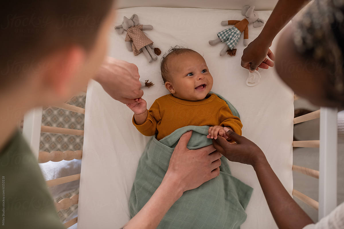 "Excited Baby Looking At Parents" by Stocksy Contributor "Milles Team ...