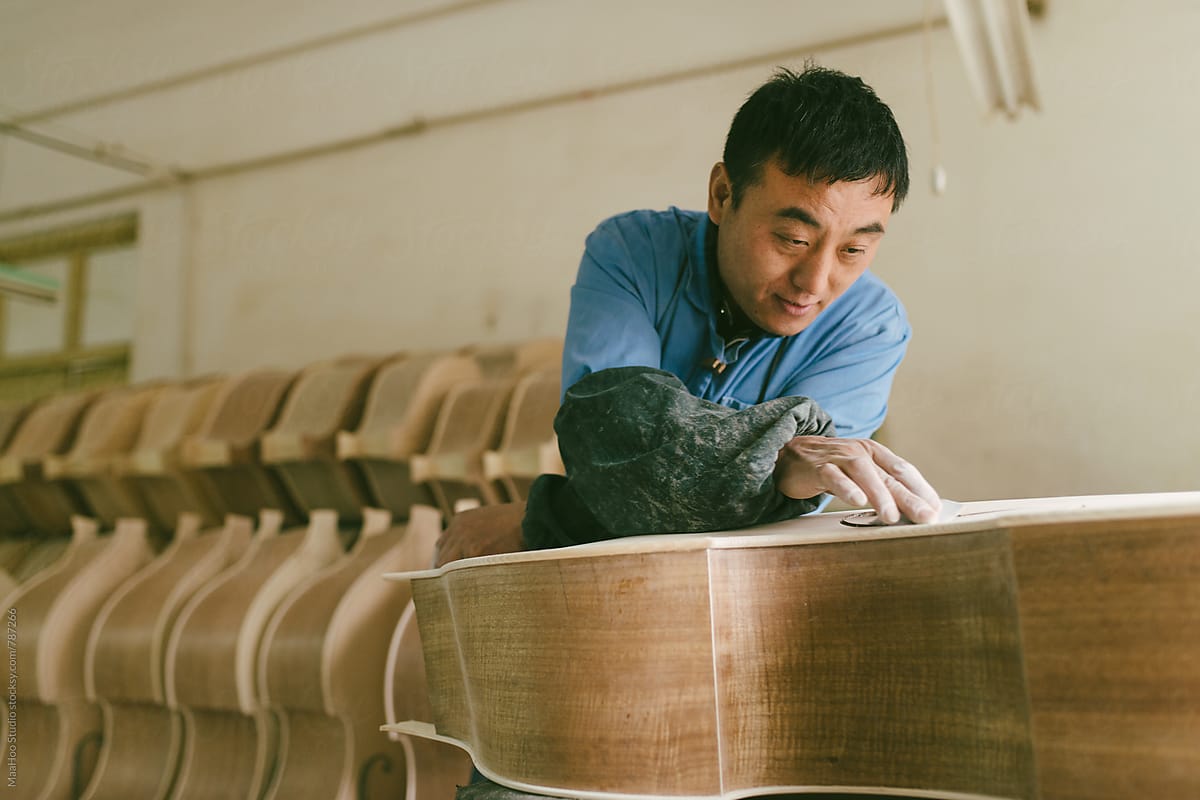 "Violoncello Maker At Work" by Stocksy Contributor "MaaHoo" - Stocksy