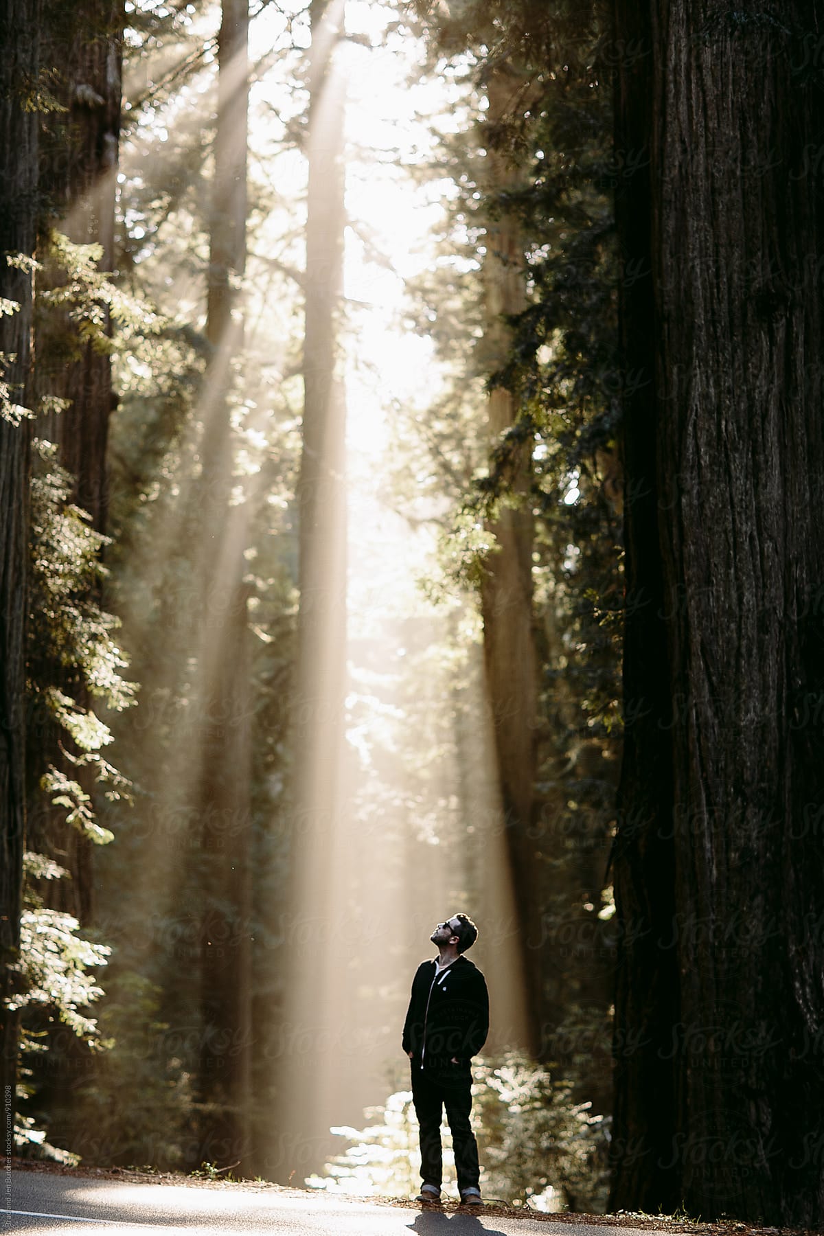 "Man Standing In Sun Beam" by Stocksy Contributor "Brad And Jen Butcher ...