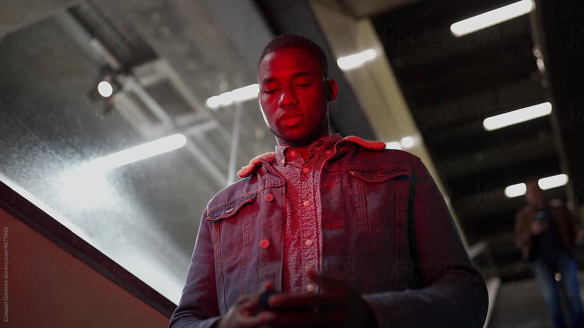 "Black Man Going Down The Escalator" by Stocksy Contributor "Ezequiel ...