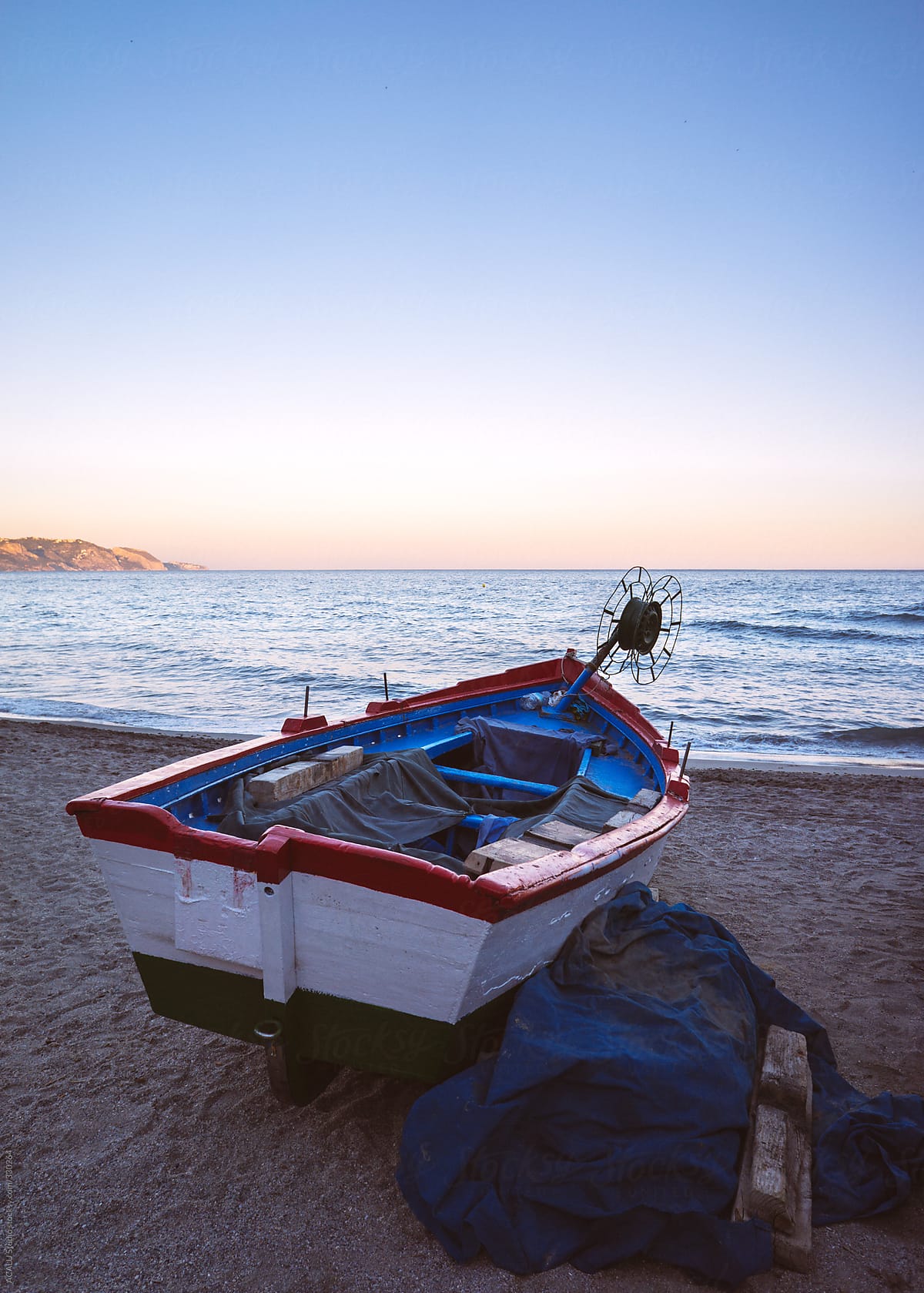 "Fishing Boat On The Beach" by Stocksy Contributor "ACALU Studio" - Stocksy
