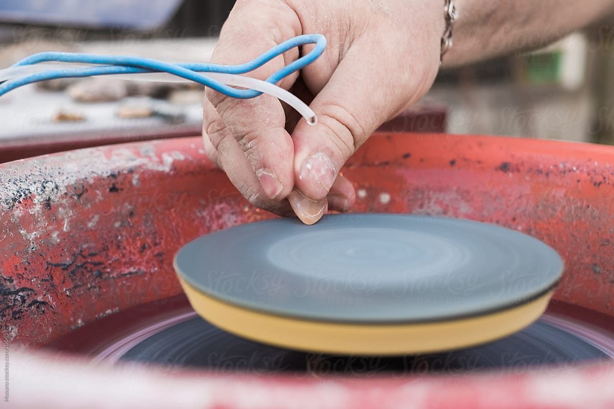 "Close Up Of A Hand Polishing Stone" by Stocksy Contributor "Mosuno ...