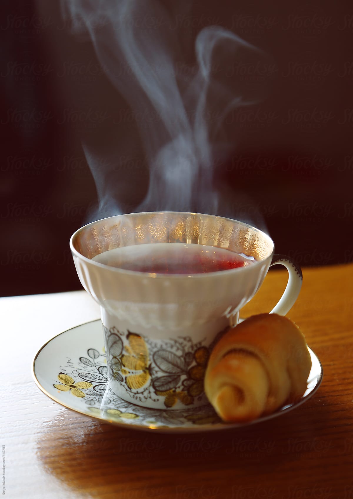 "Tea And Cookie" by Stocksy Contributor "Sonja Lekovic" - Stocksy