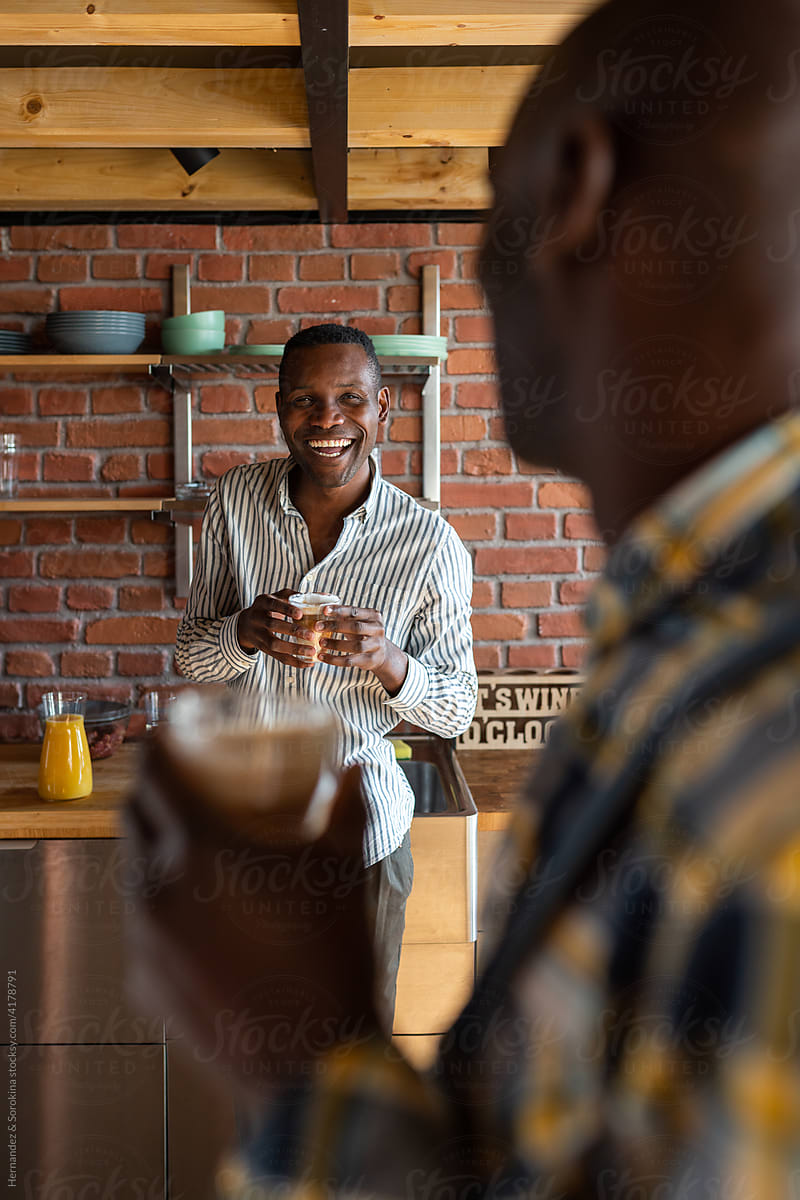 "People Drinking Coffee At Kitchen" by Stocksy Contributor "Hernandez ...