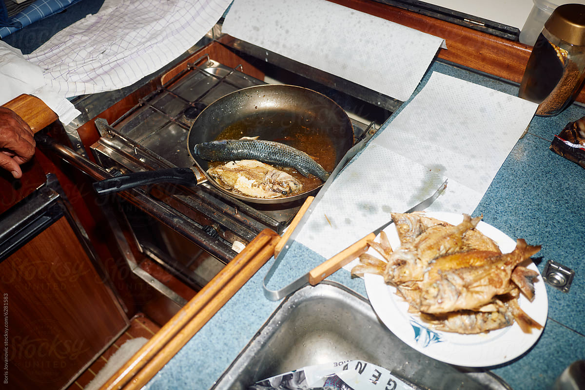 "Pan-fried Fish On Board" by Stocksy Contributor "Boris Jovanovic ...