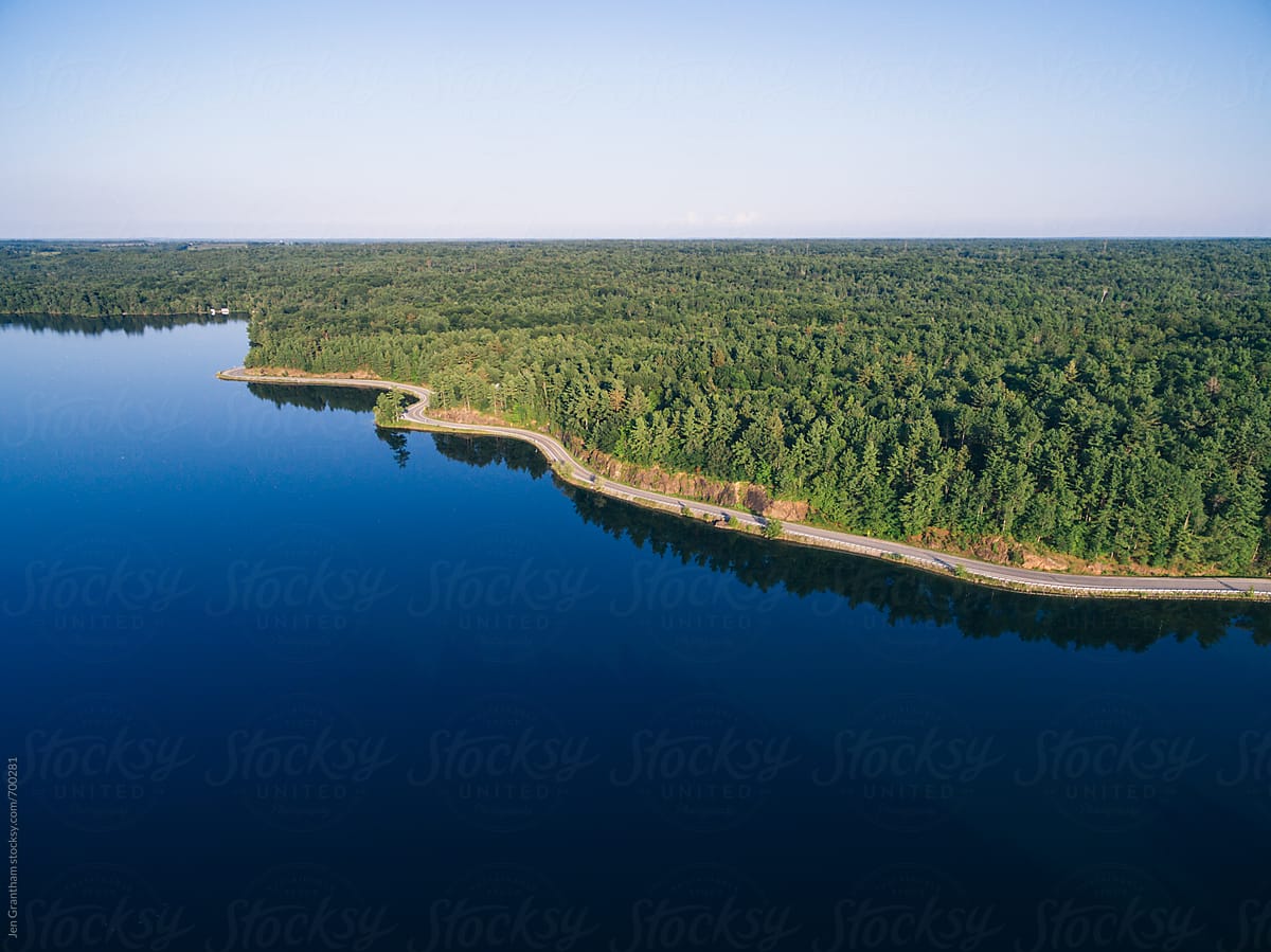 "Winding Road Next To A Calm Lake" by Stocksy Contributor "Jen Grantham ...