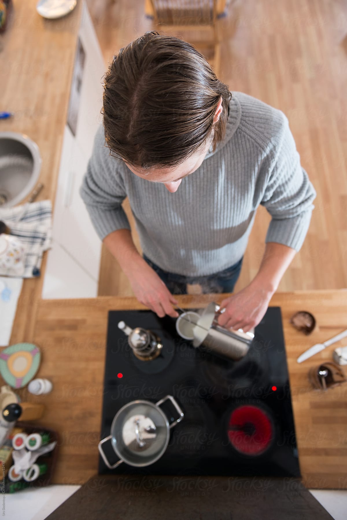 "Man Brewing Coffee" by Stocksy Contributor "Urs Siedentop & Co" - Stocksy