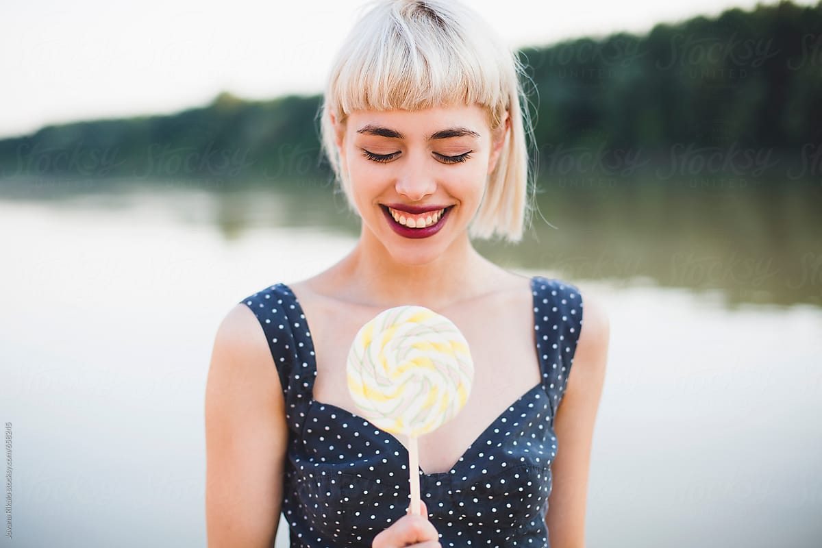 "Young Woman Eating A Lollipop" by Stocksy Contributor "Jovana Rikalo ...