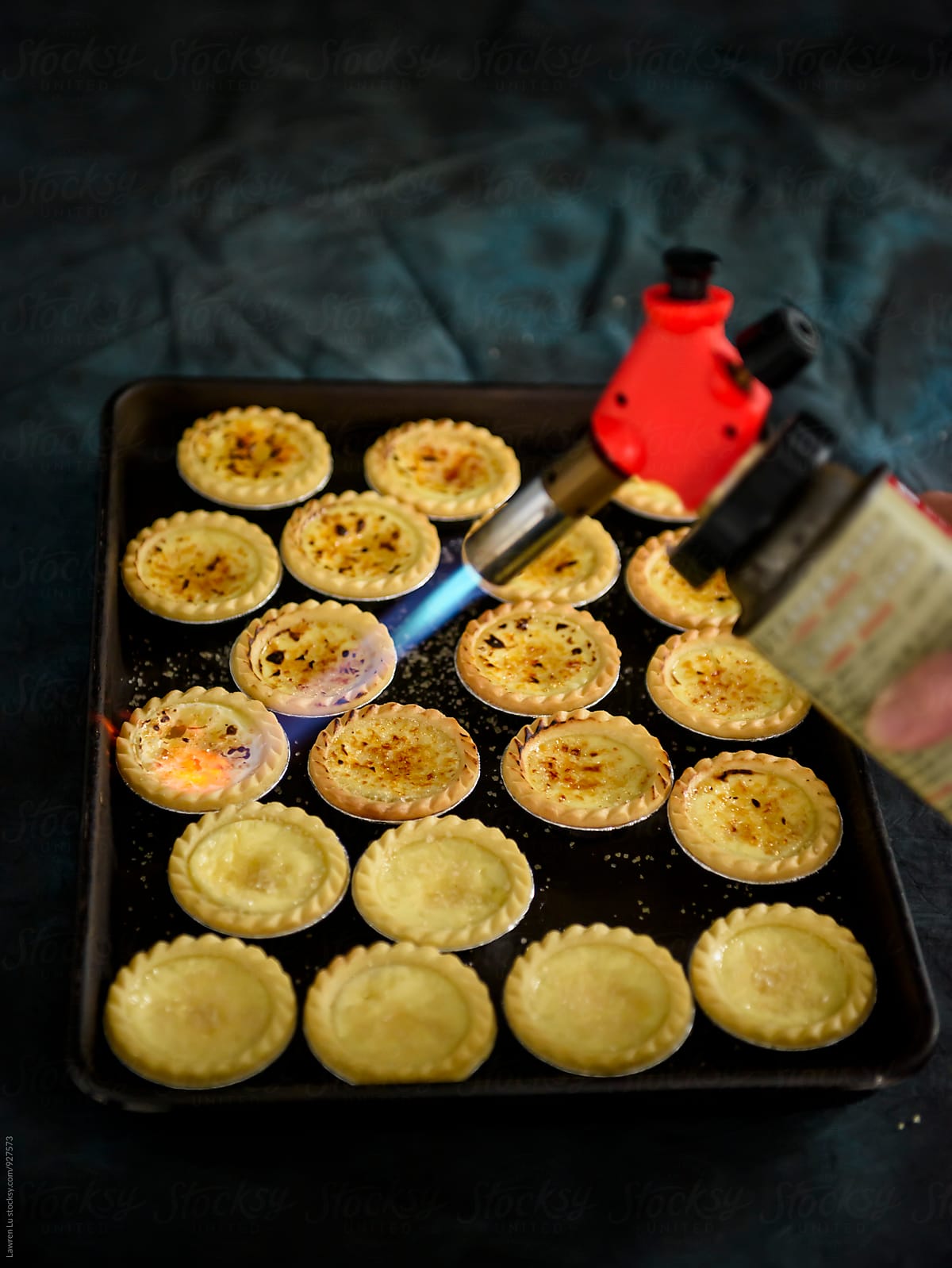 "Process Of Burning Caramel Custard With Gas Torch" by Stocksy ...